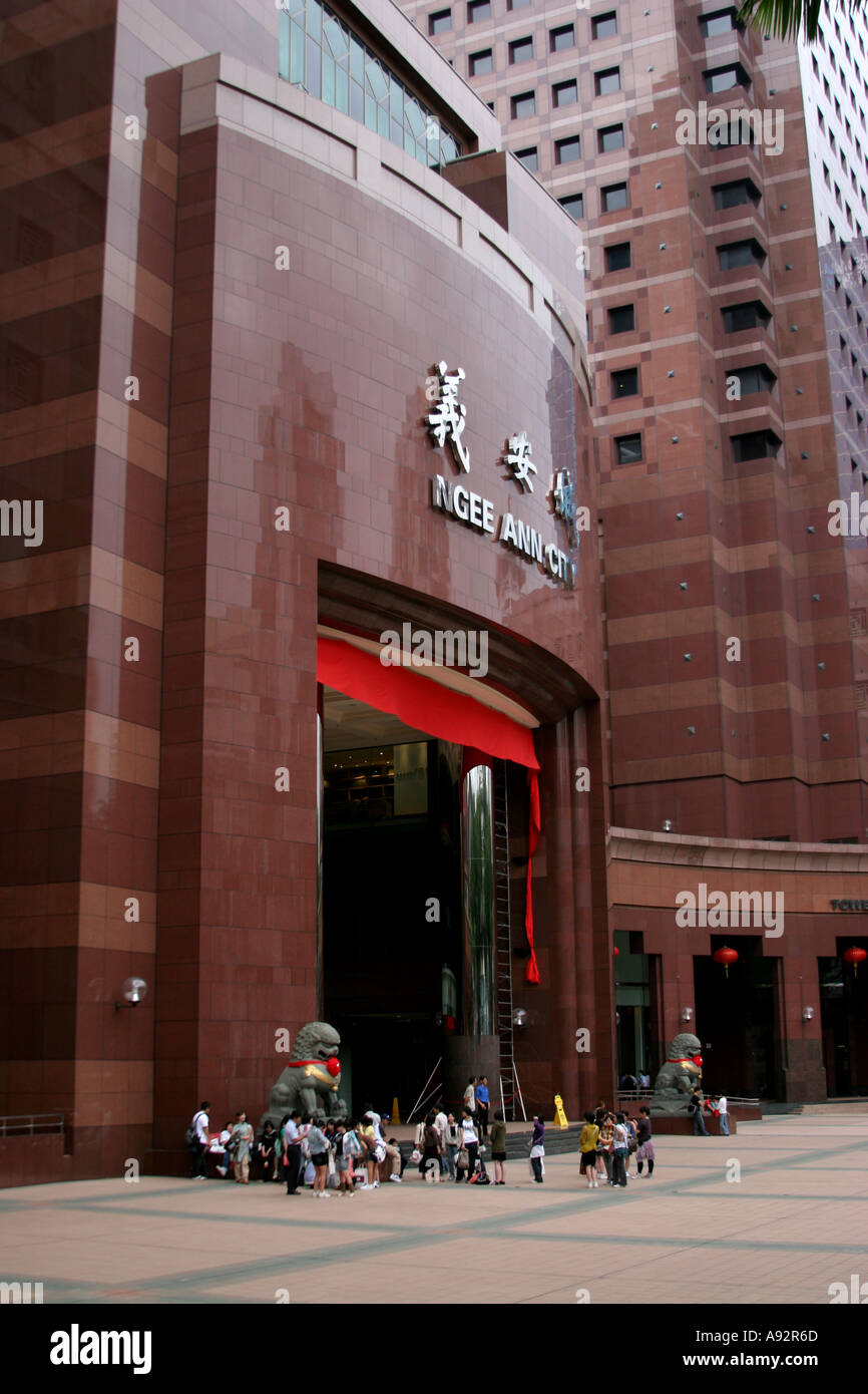 Tourists gathering outside the Ngee Ann City shopping complex in ...