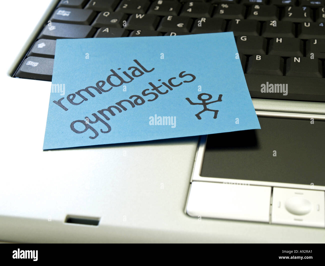 memo note on notebook remedial gymnastics Stock Photo - Alamy