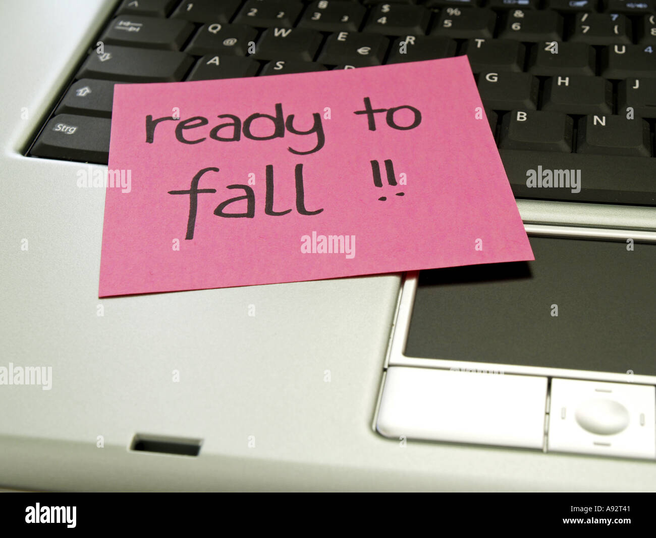 memo note on notebook, ready to fall Stock Photo - Alamy