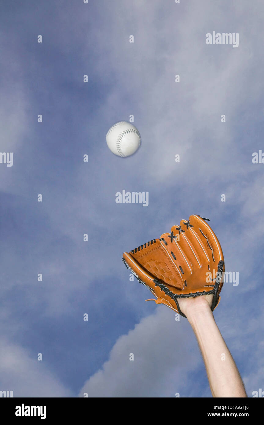 Hand catching a ball hi-res stock photography and images - Alamy