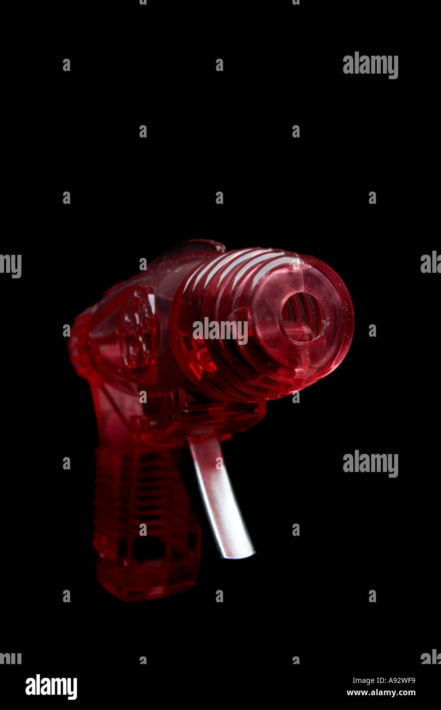 still life of red toy gun Stock Photo - Alamy