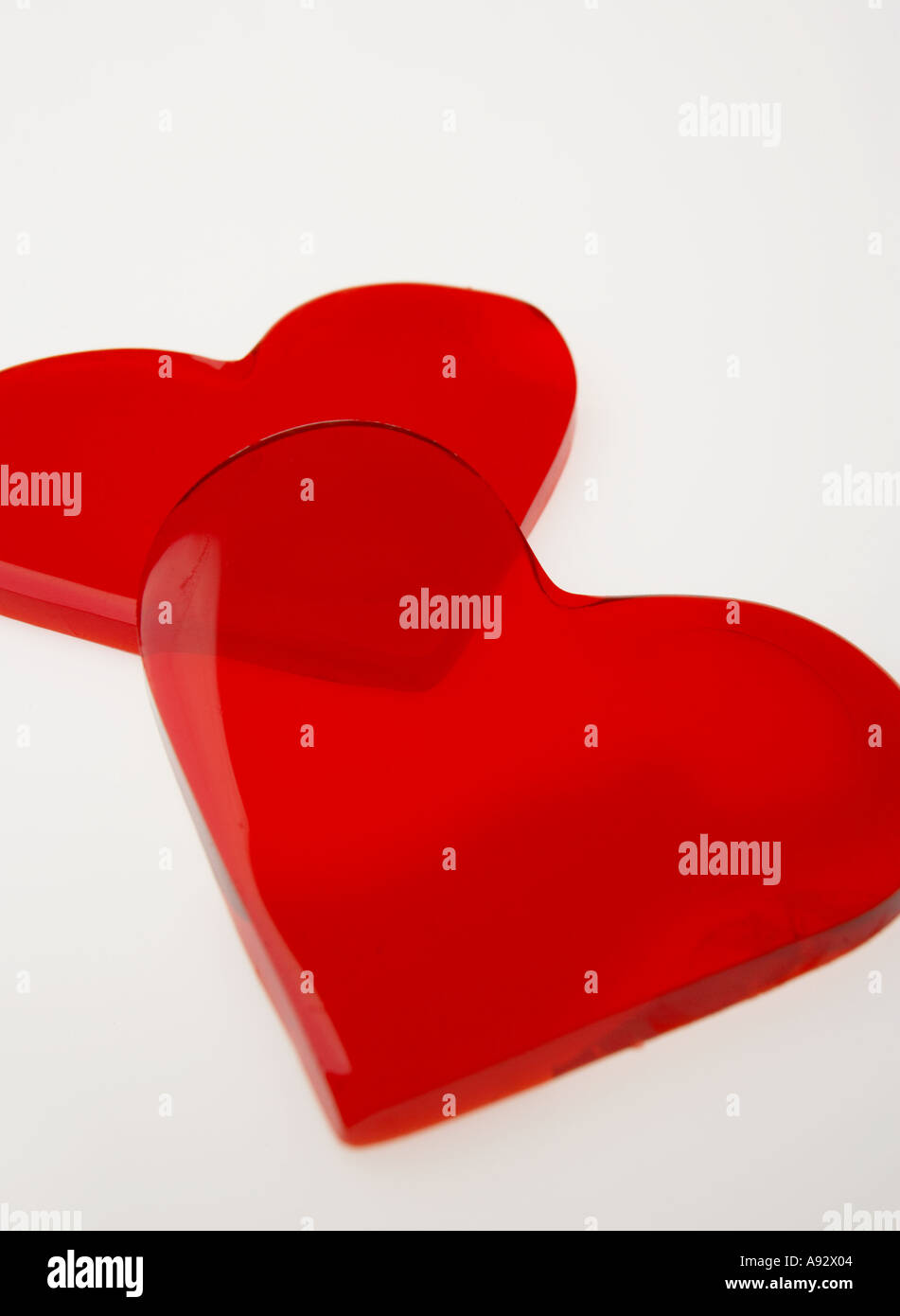 Two overlapping heart shapes warm hi-res stock photography and images ...