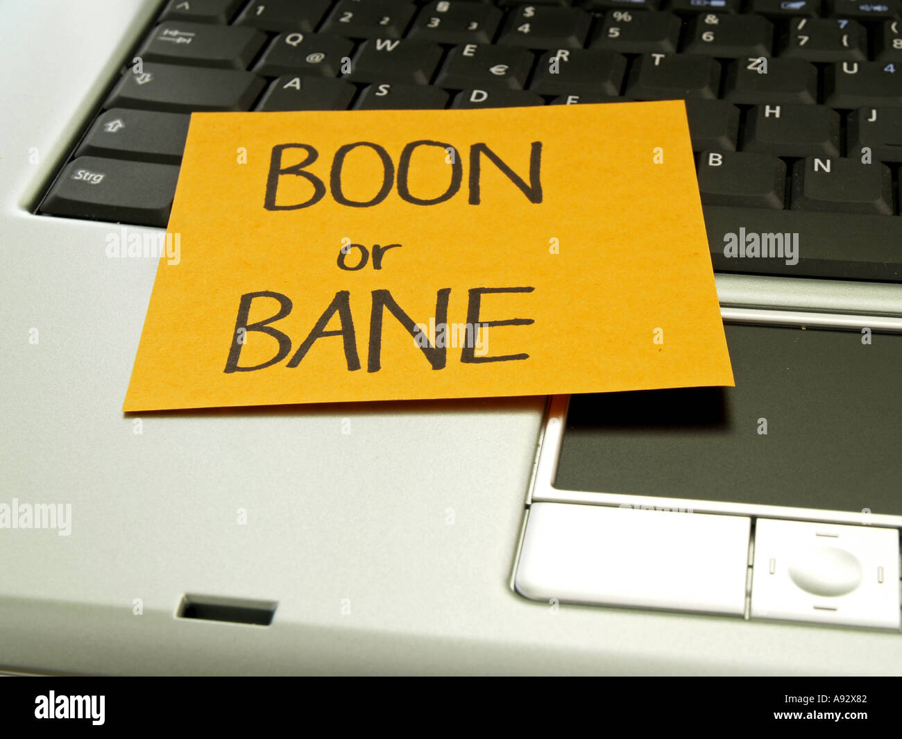 memo note on notebook boon or bane Stock Photo - Alamy