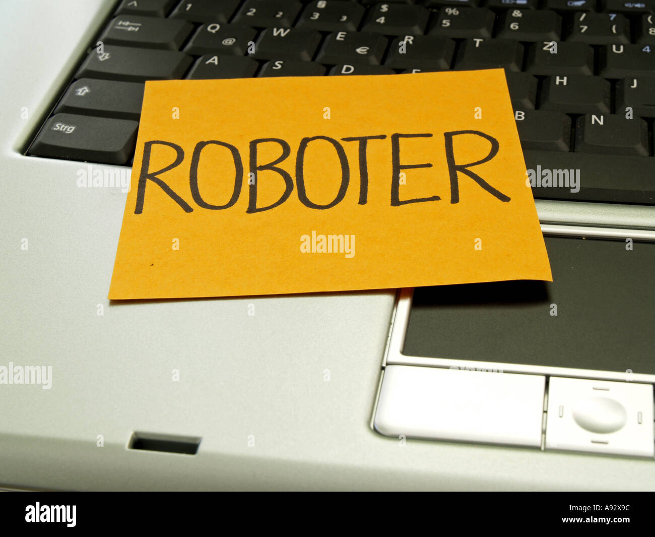 memo note on notebook, robot Stock Photo - Alamy