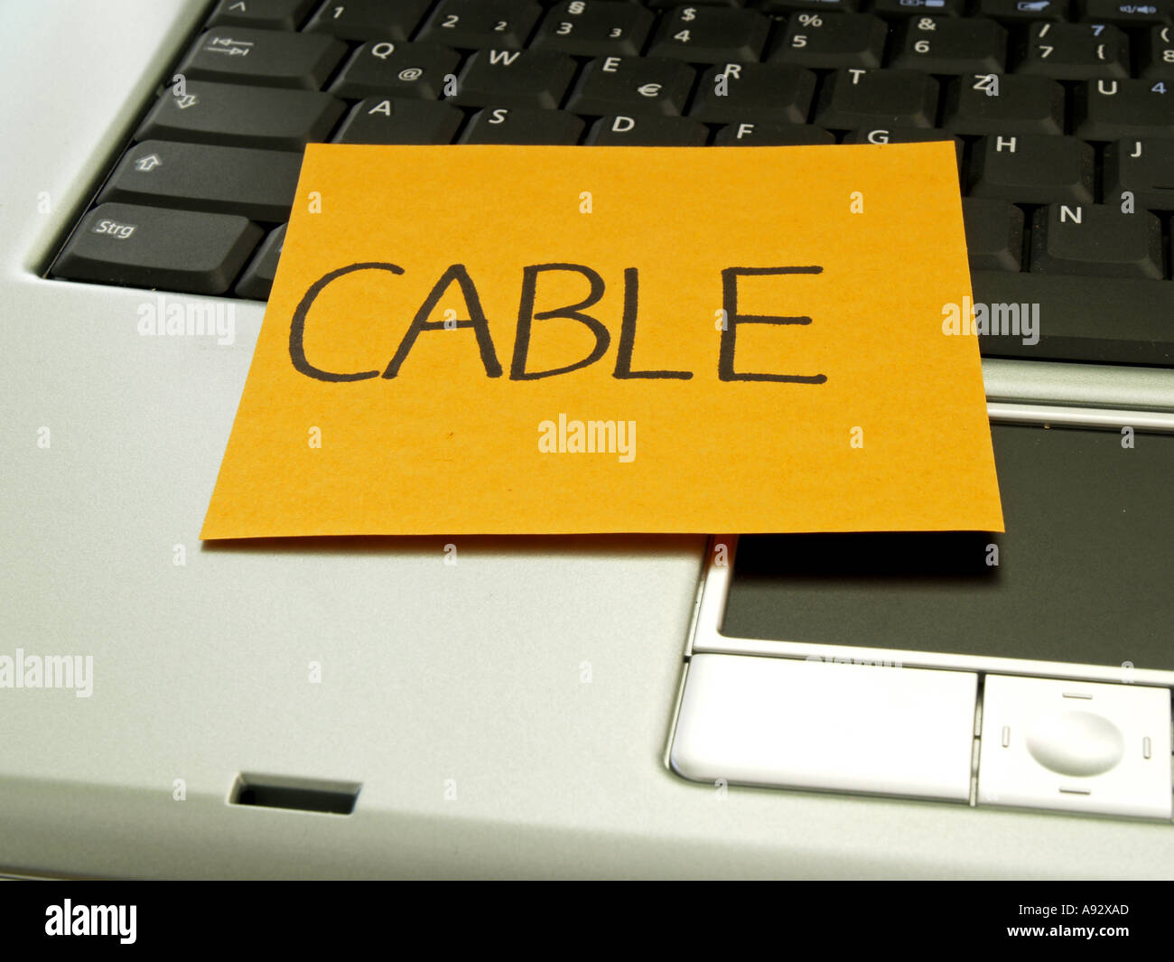 memo note on notebook, cable Stock Photo - Alamy