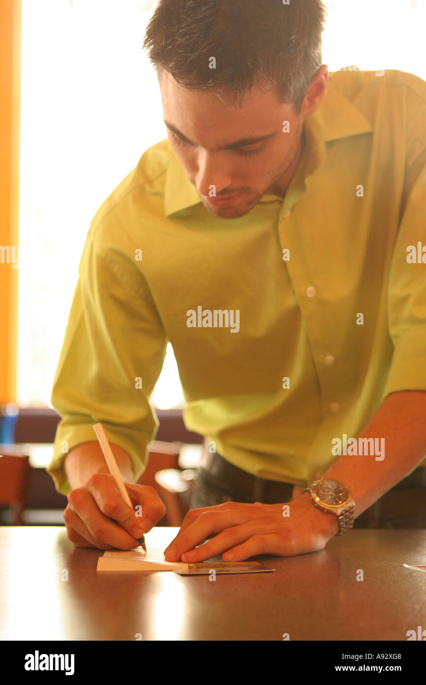 Signing bill restaurant hi-res stock photography and images - Alamy
