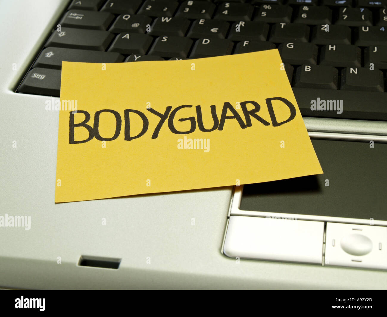 memo note on notebook, bodyguard Stock Photo - Alamy