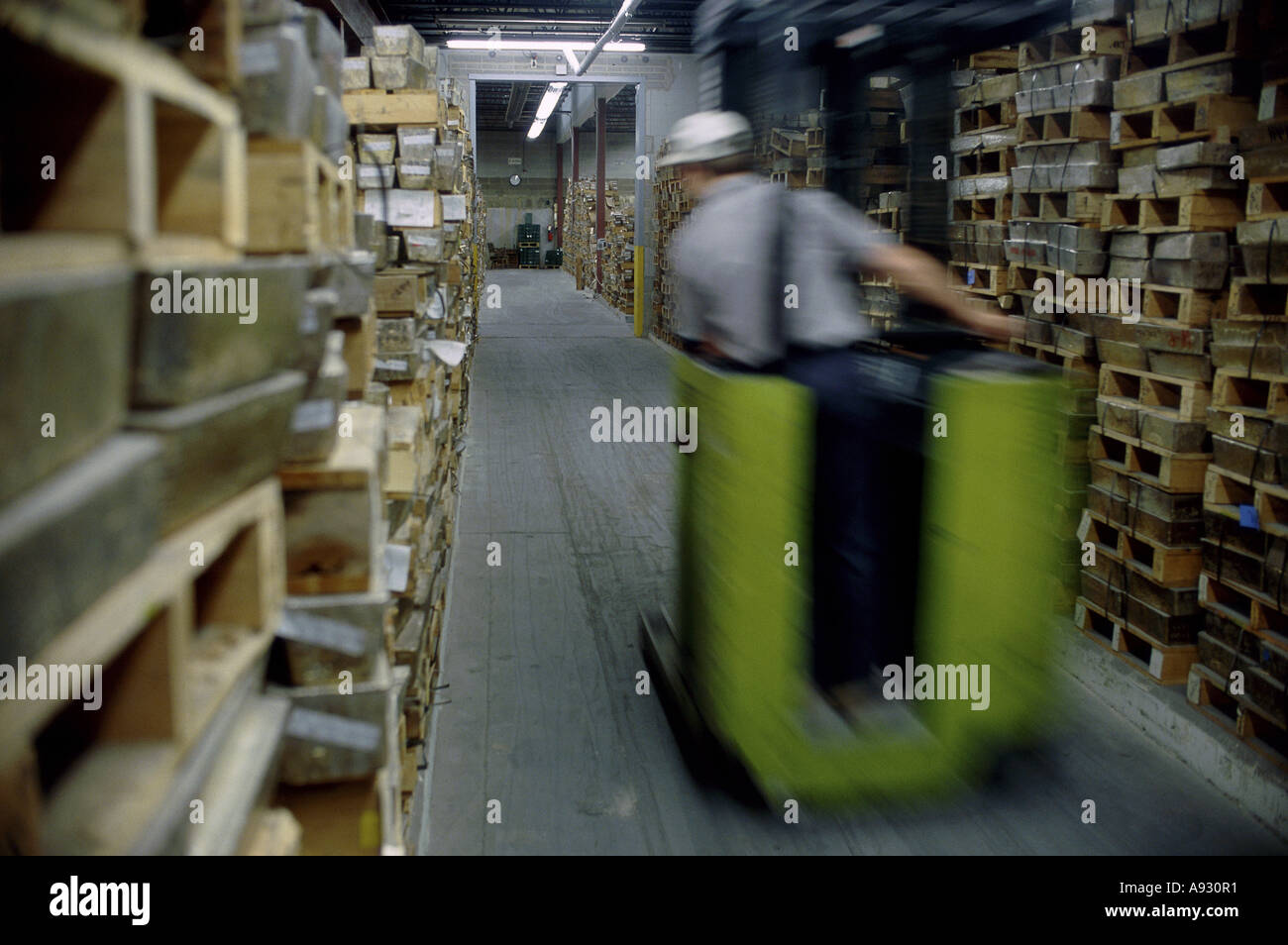 Rear view of a man driving a forklift Stock Photo - Alamy