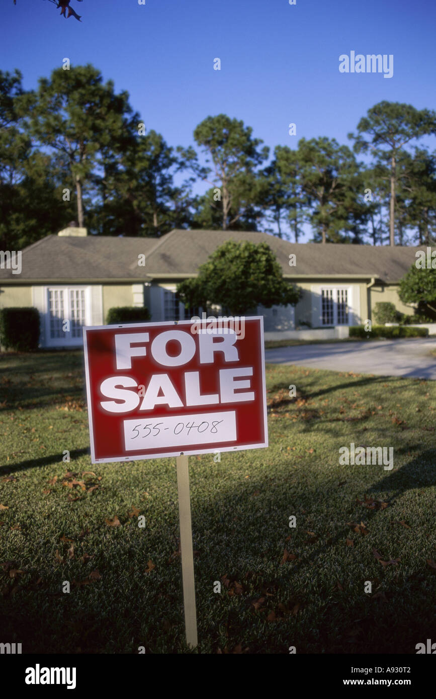 For sale sign board in the front yard of a house Stock Photo - Alamy