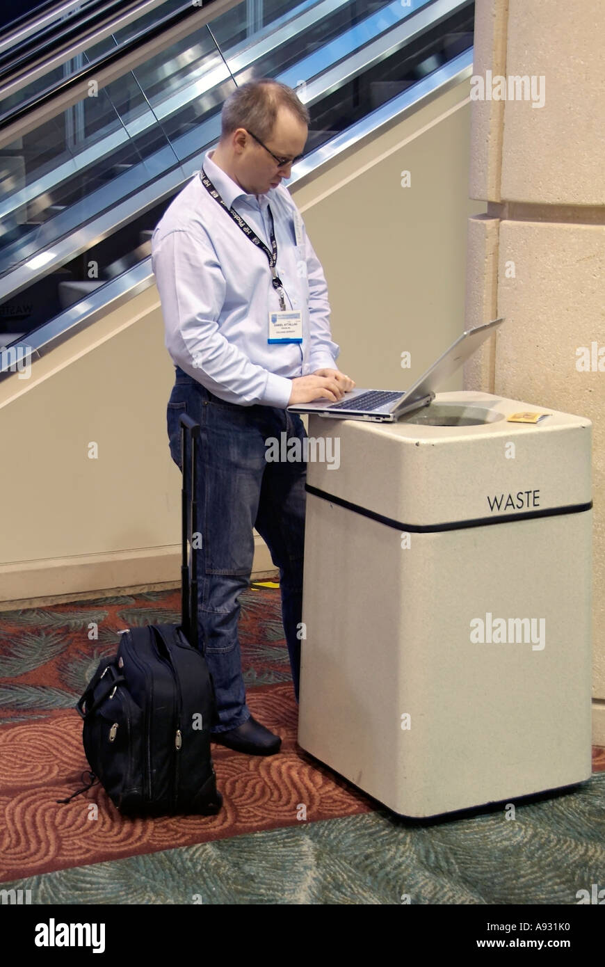 Adult businessman professional works on wireless laptop computer while ...