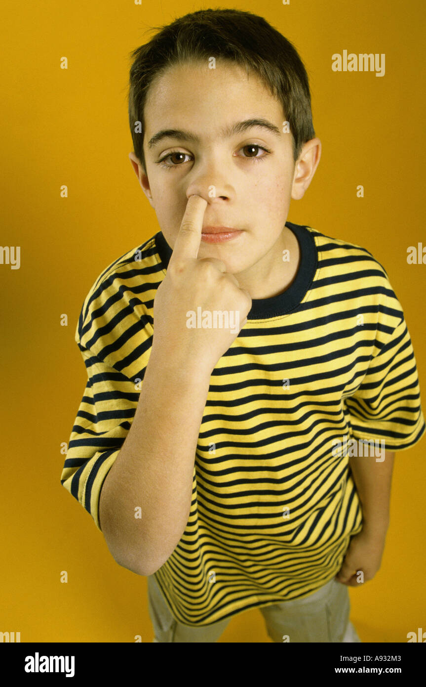 Portrait of a boy picking his nose Stock Photo - Alamy