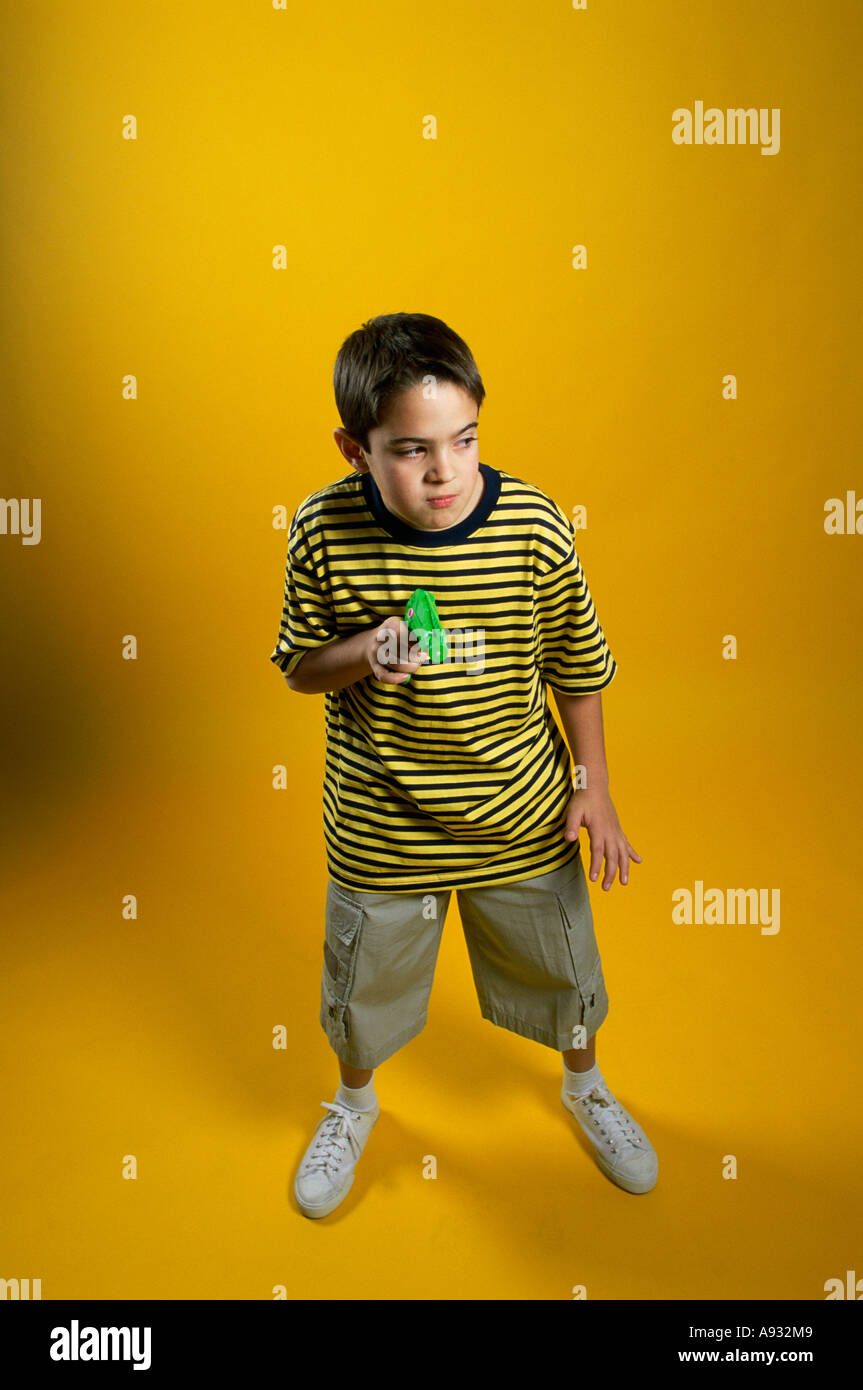 Boy with a toy gun hi-res stock photography and images - Alamy