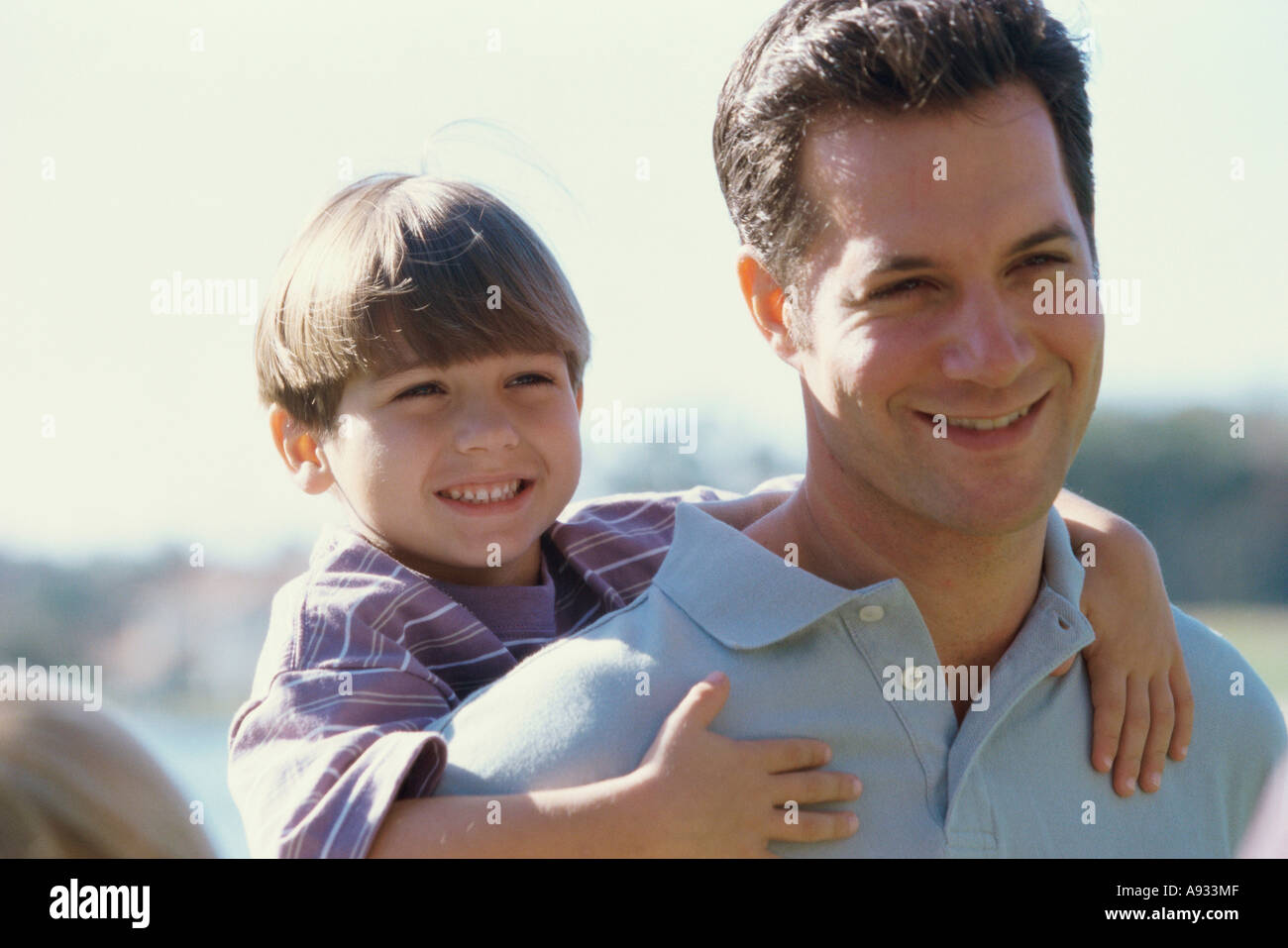 Close-up of a son hugging his father from behind Stock Photo - Alamy