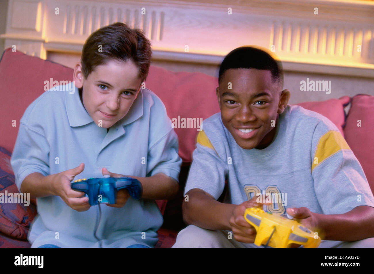 Portrait of two teenage boys playing video games Stock Photo - Alamy