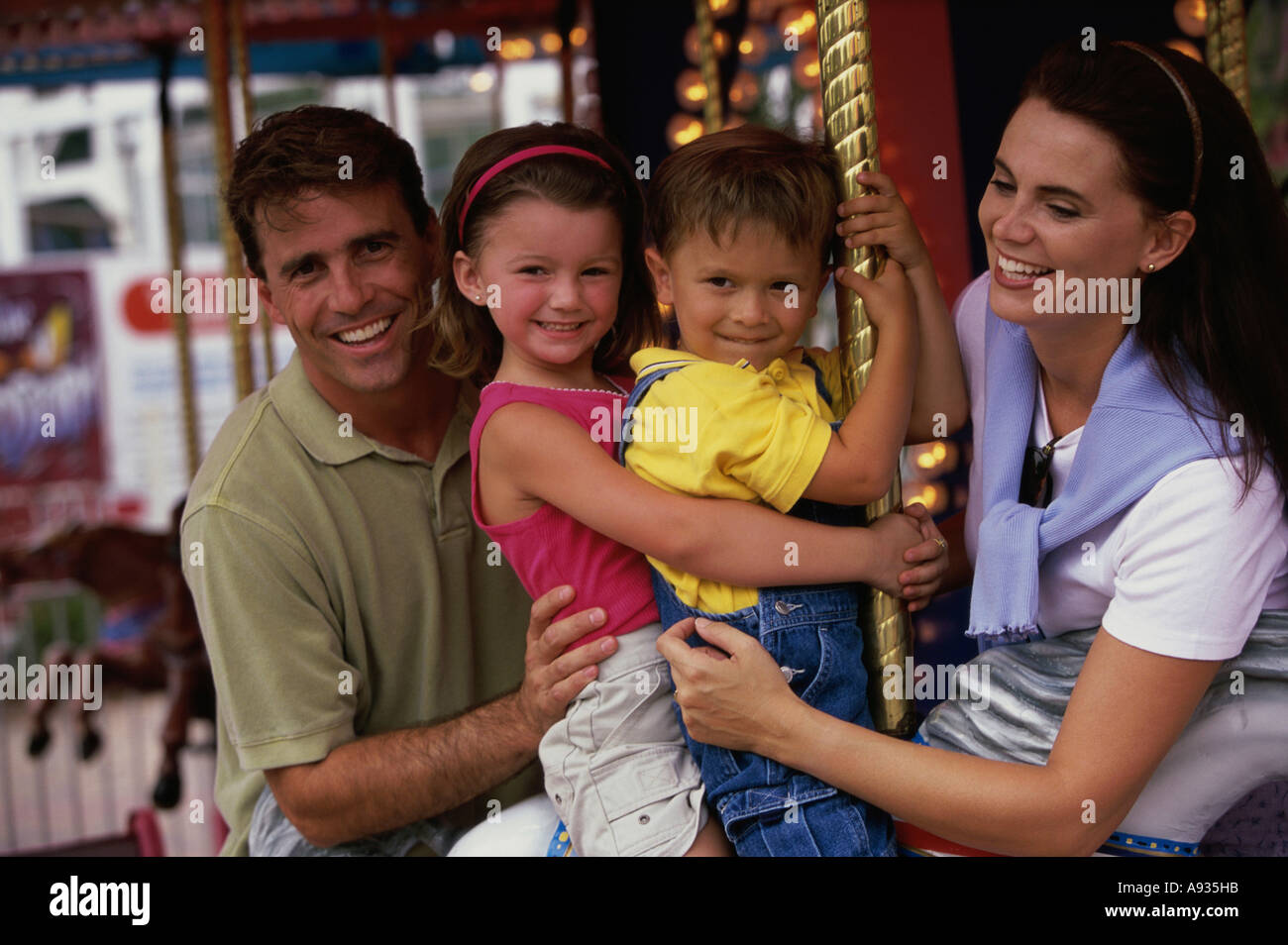 Women riding on carousel hi-res stock photography and images - Alamy