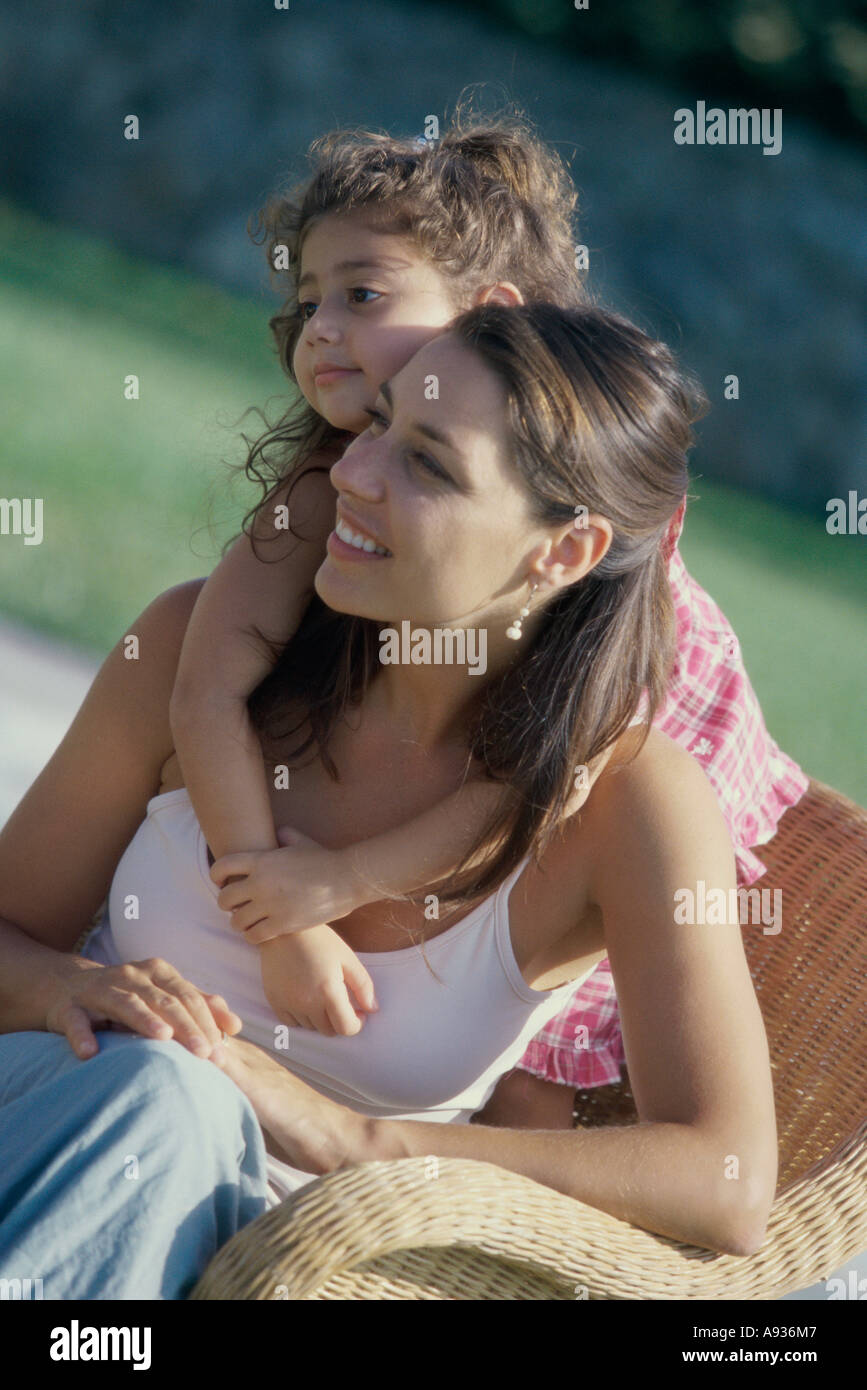 Daughter hugging her mother from behind Stock Photo - Alamy