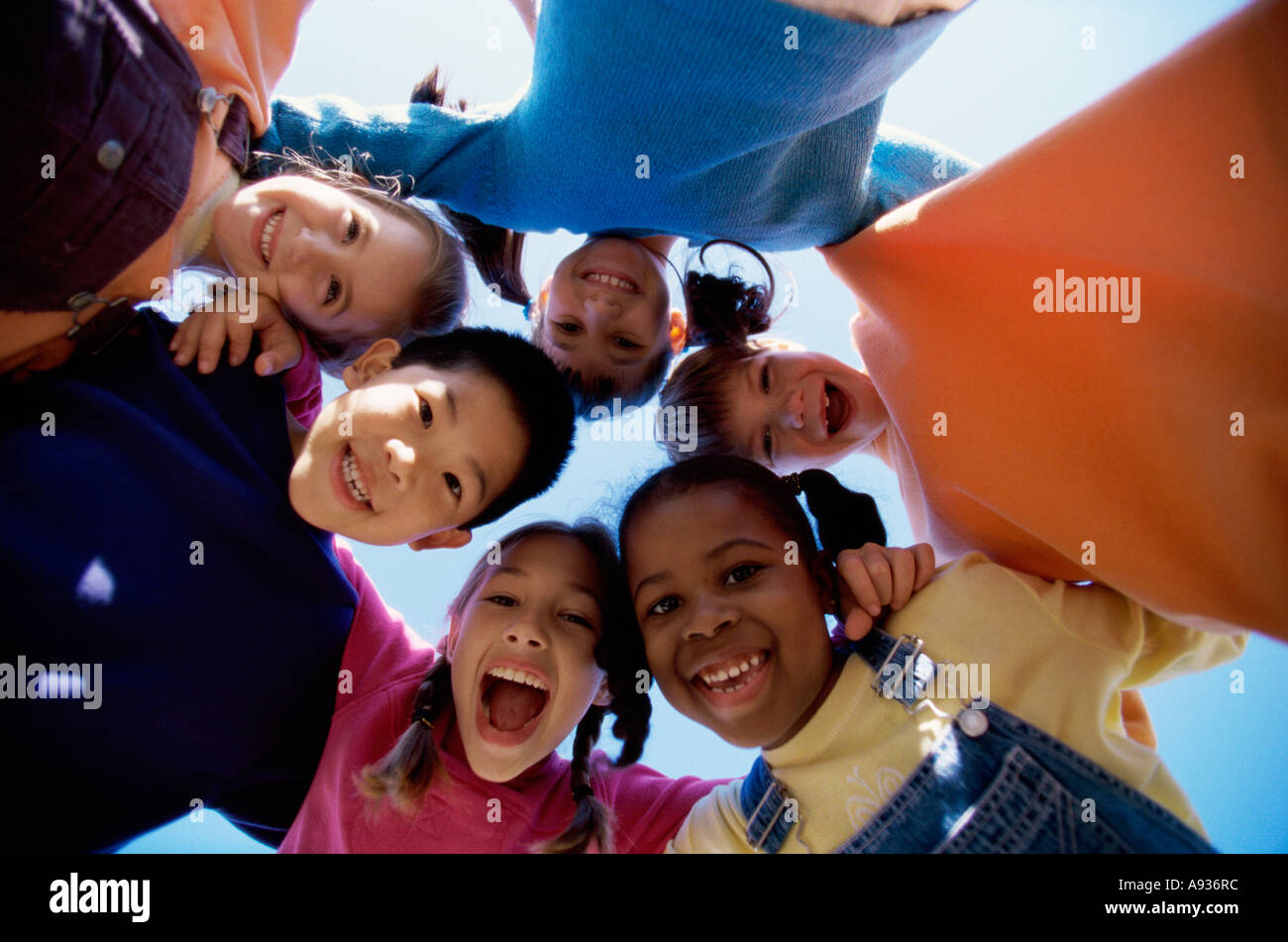 Portrait of a group of children in a huddle Stock Photo - Alamy