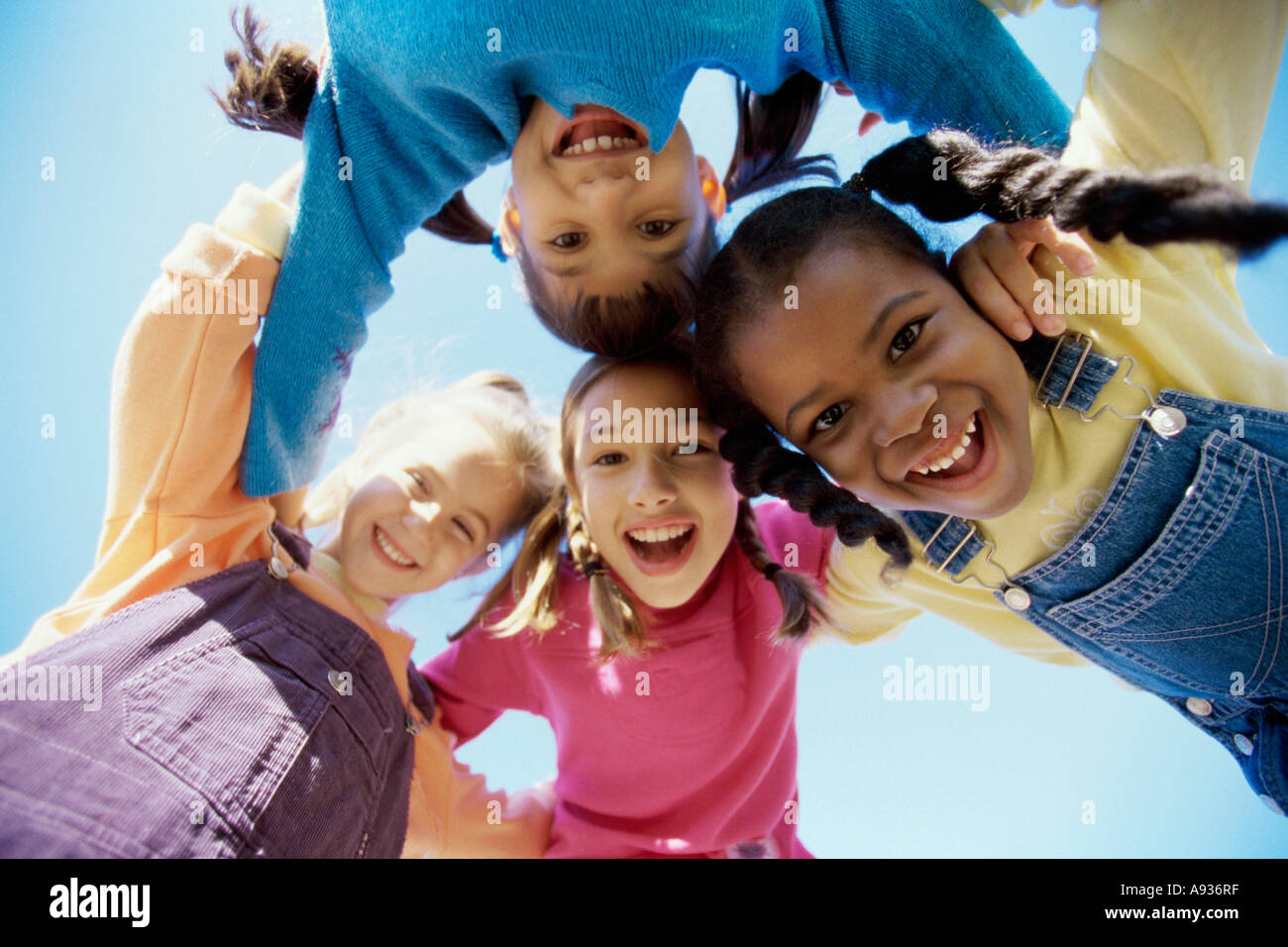 Portrait of a group of children in a huddle Stock Photo - Alamy