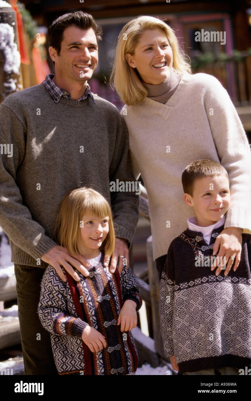 Parents standing with their son and daughter Stock Photo - Alamy