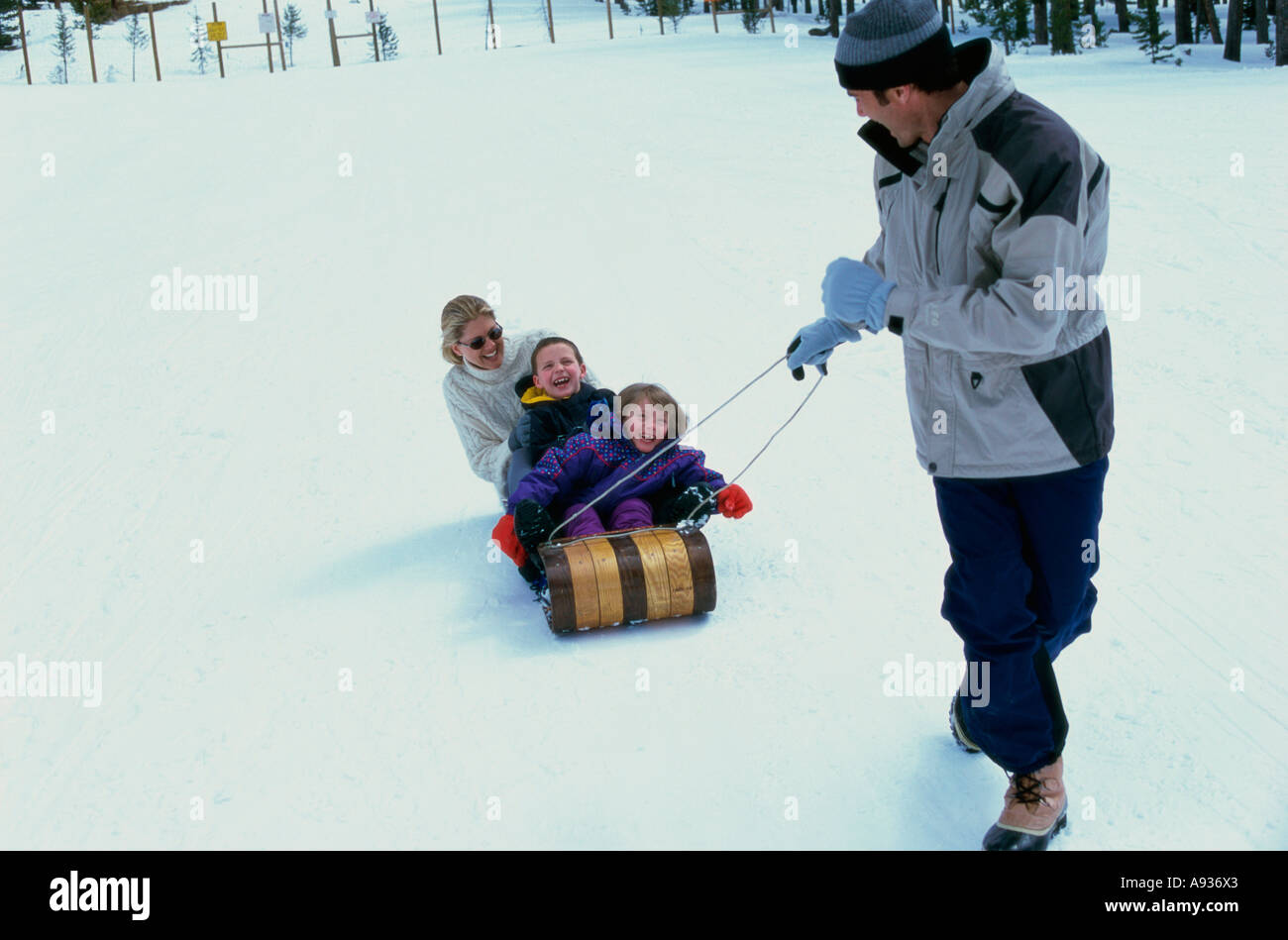 Back view man pulling sled hi-res stock photography and images - Alamy