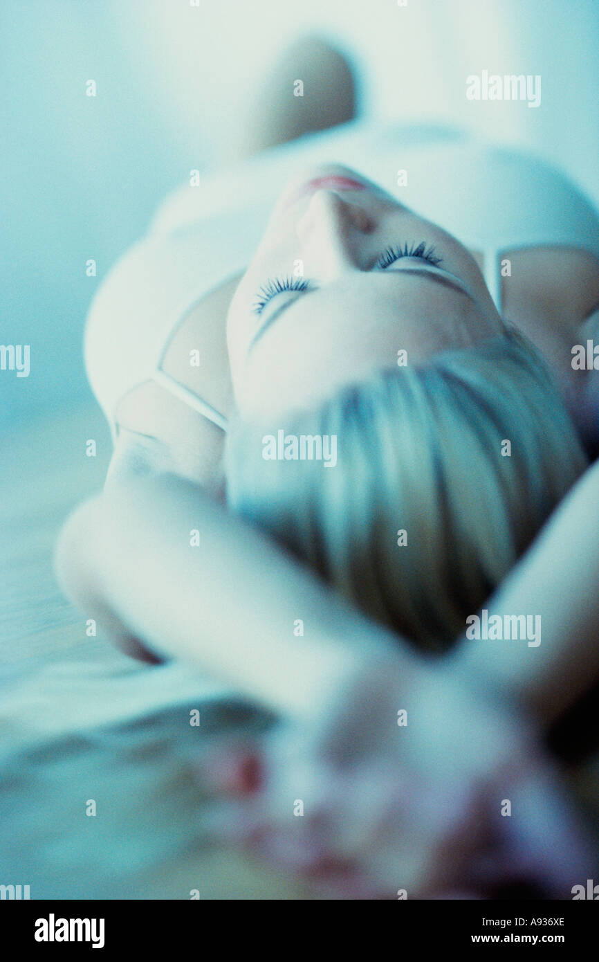 Young woman lying on back Stock Photo - Alamy