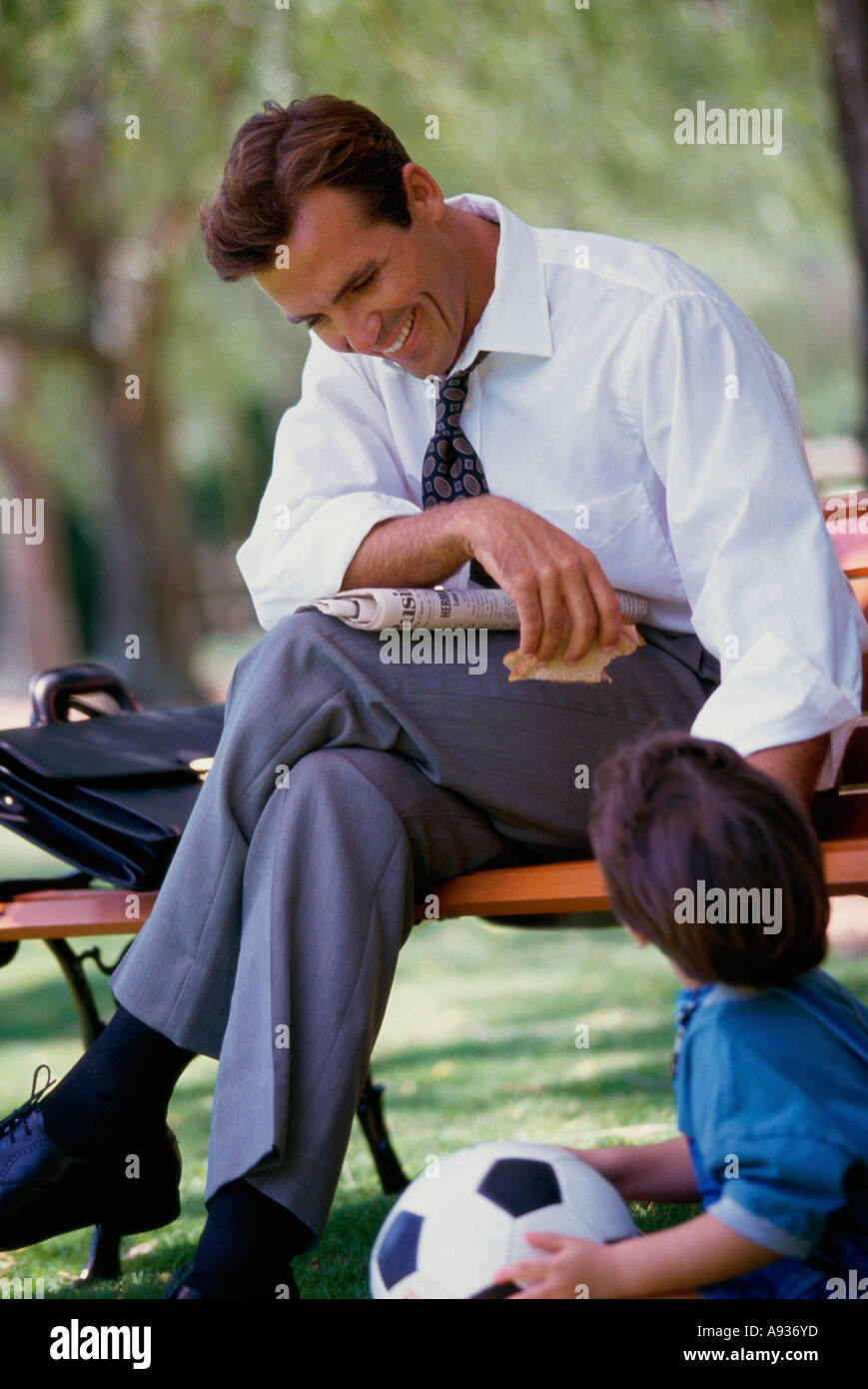 Father looking at his son Stock Photo - Alamy