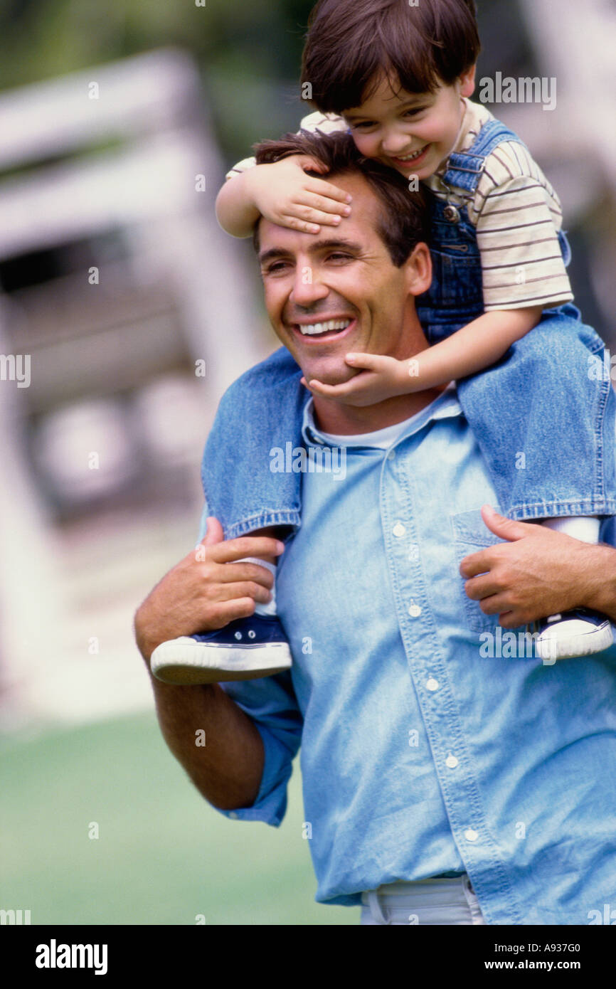 Father carrying his daughter on his shoulders Stock Photo - Alamy