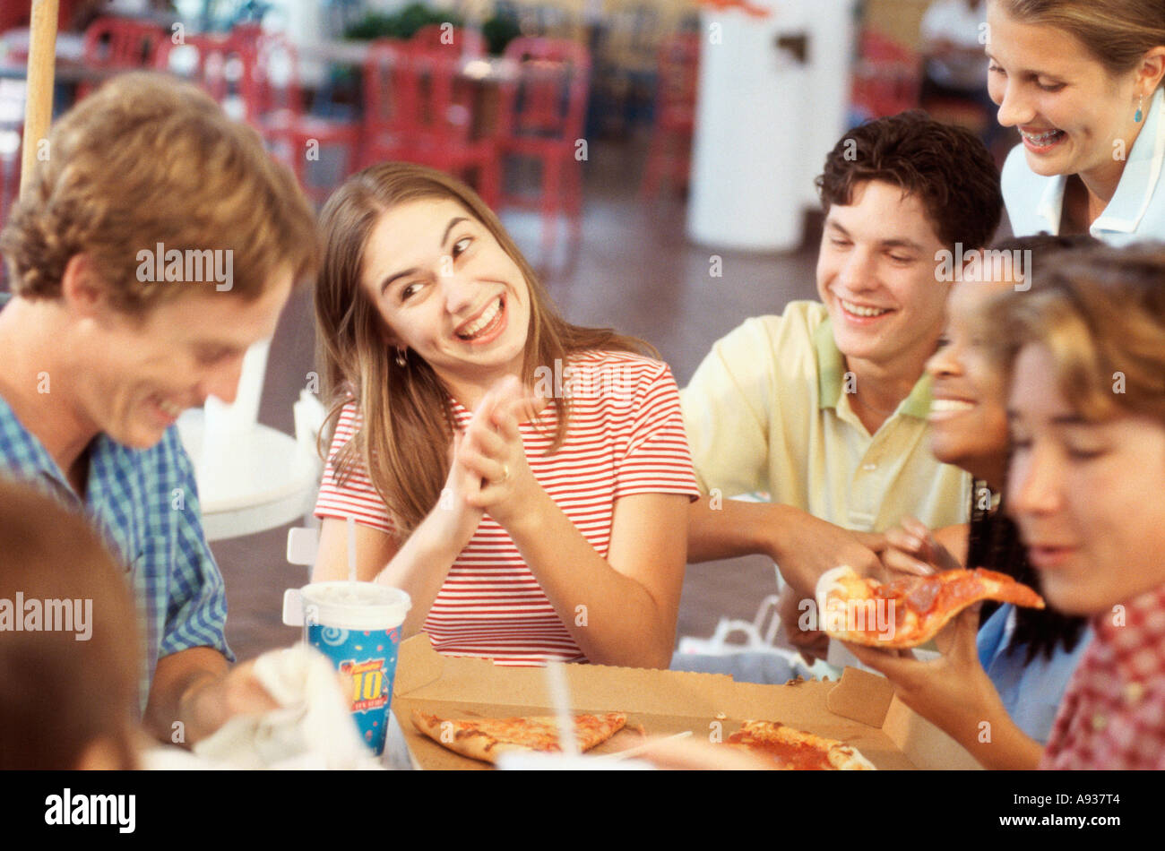 Group of teenagers smiling in a restaurant Stock Photo - Alamy