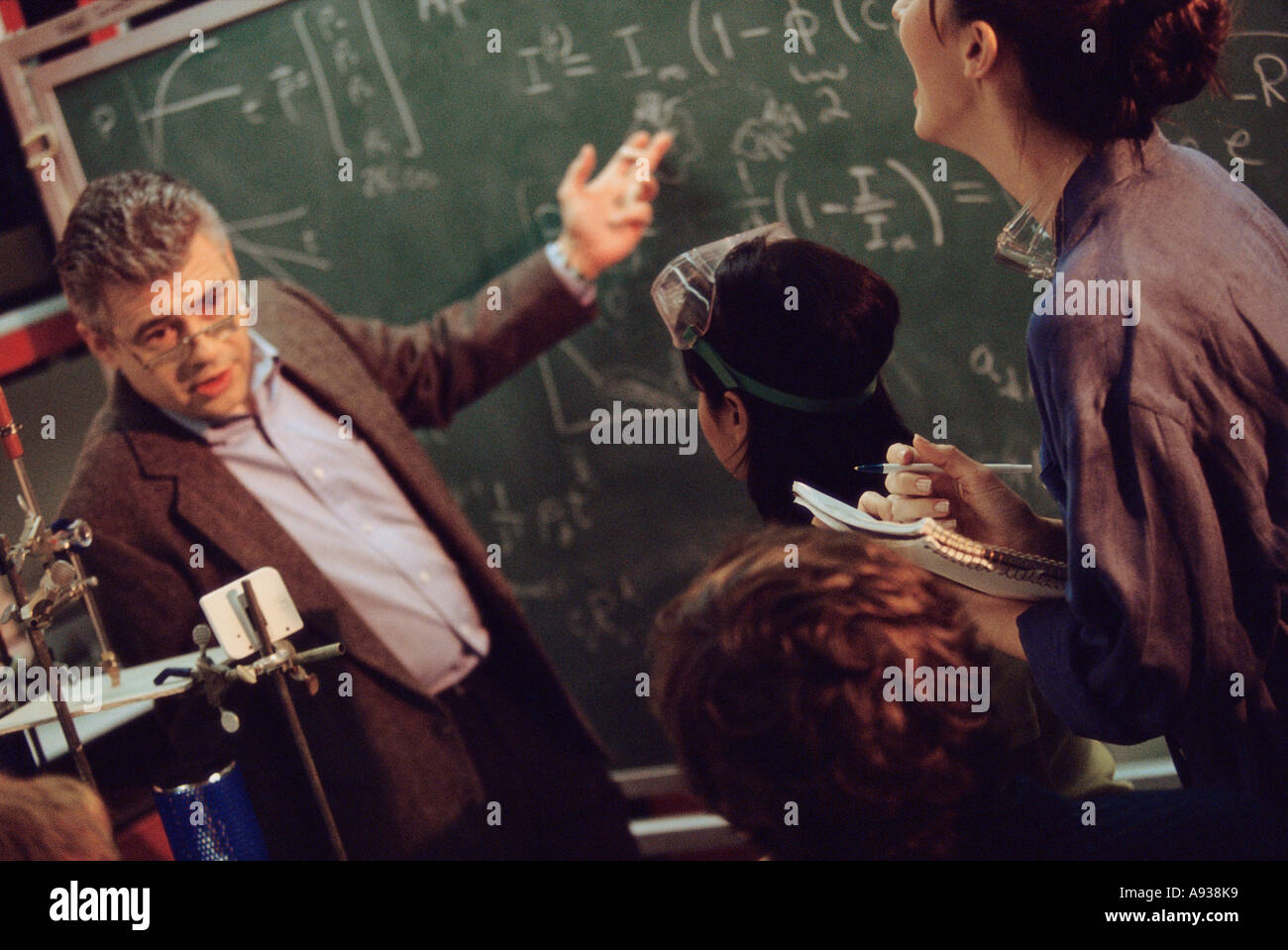 Professor teaching in a classroom Stock Photo - Alamy
