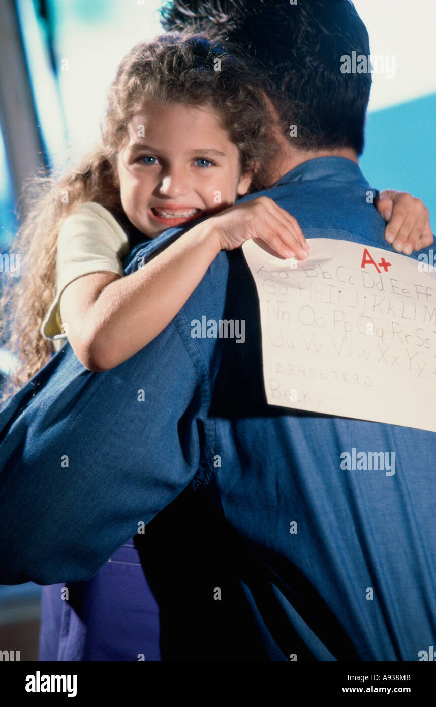 Portrait of a daughter hugging her father Stock Photo - Alamy