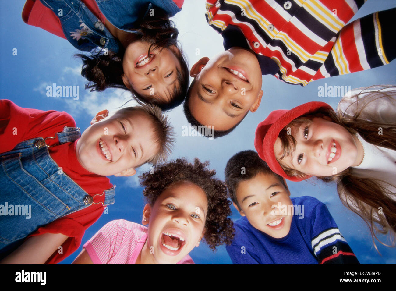 Portrait of a group of children in a huddle Stock Photo - Alamy