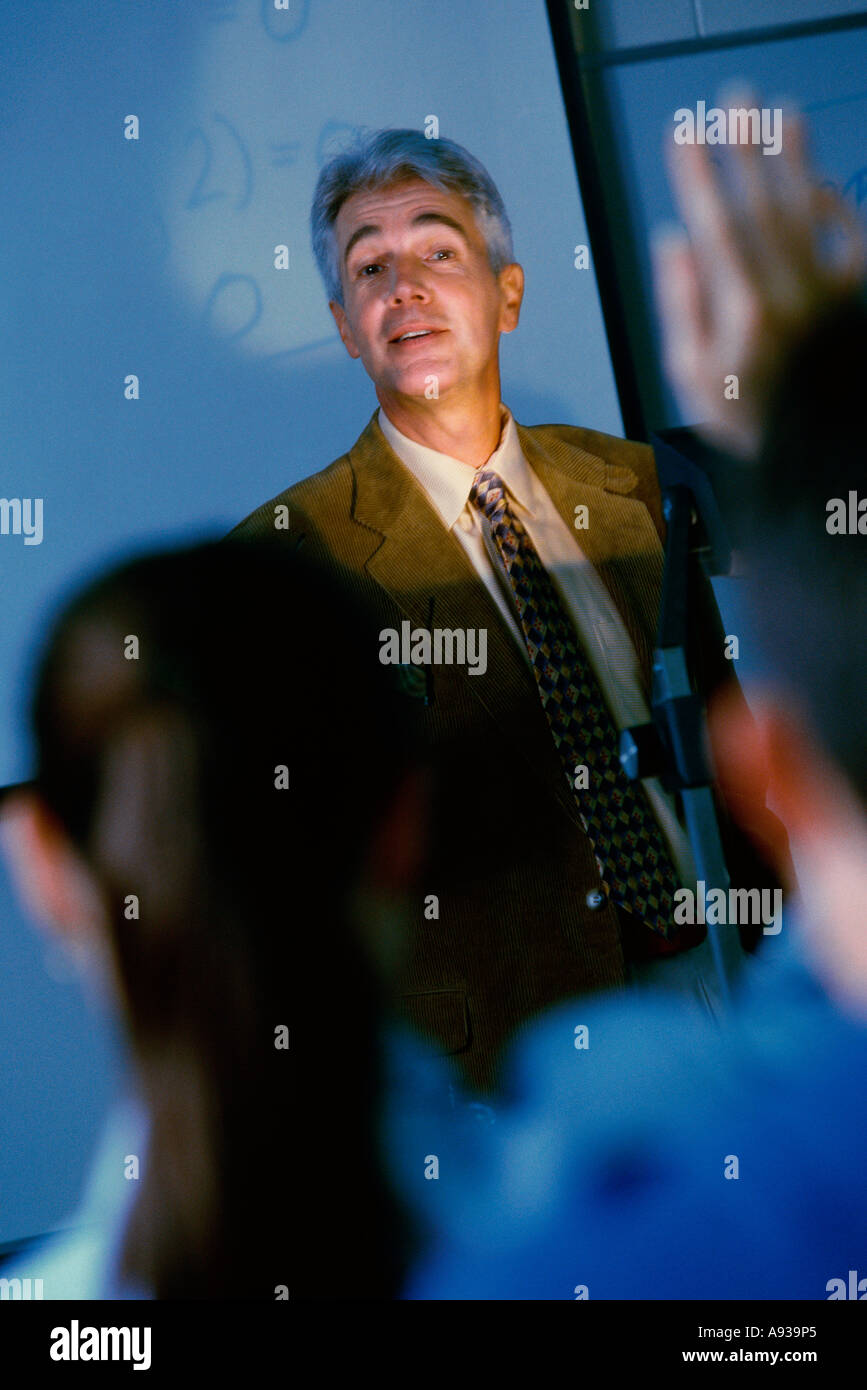Teacher teaching in a classroom Stock Photo - Alamy