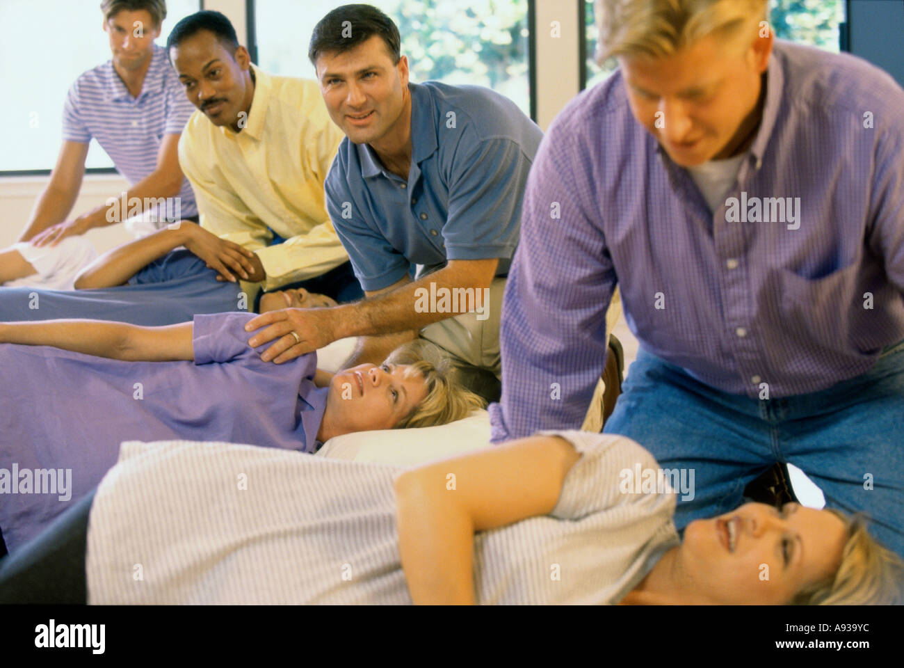 Pregnant wives and their husbands in a prenatal class Stock Photo - Alamy