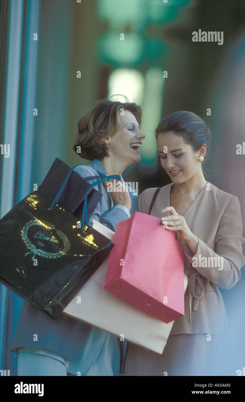 Three friends walking shopping bags hi-res stock photography and images ...