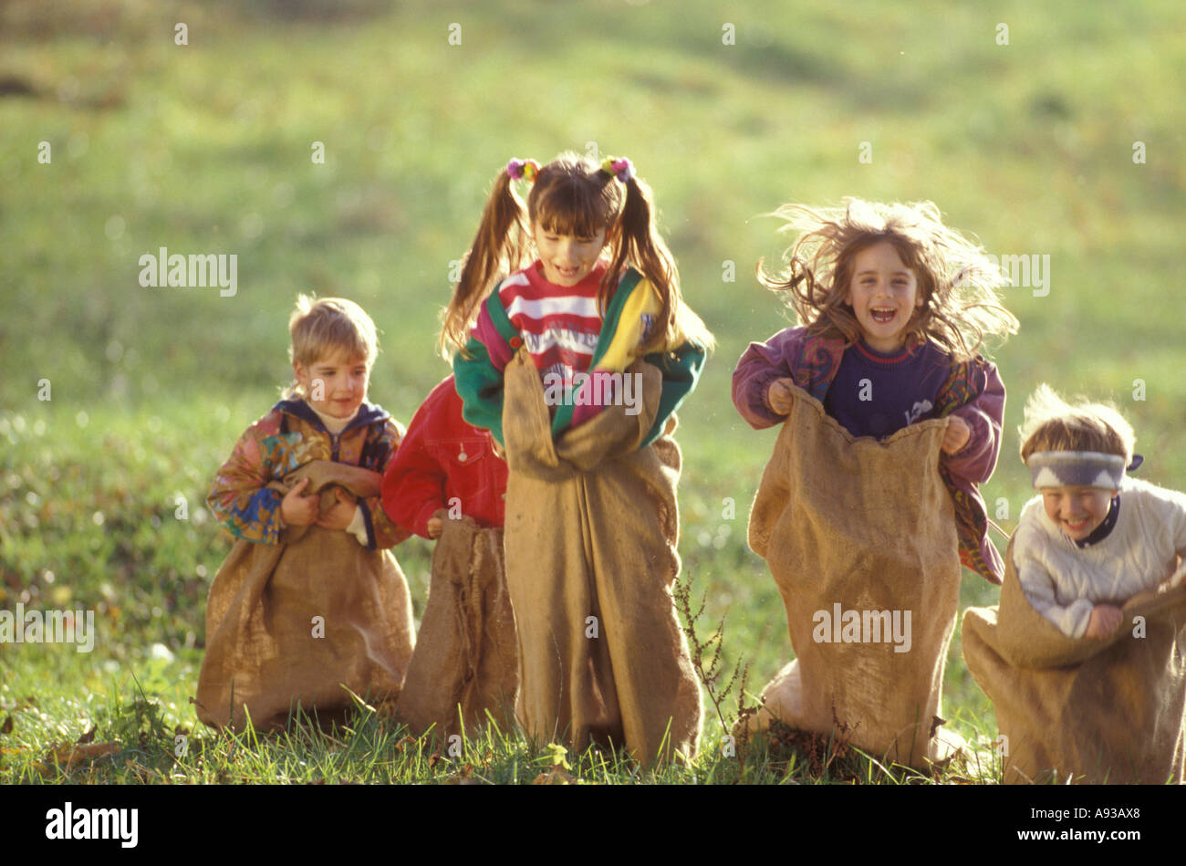 Childrens sack race Stock Photo - Alamy