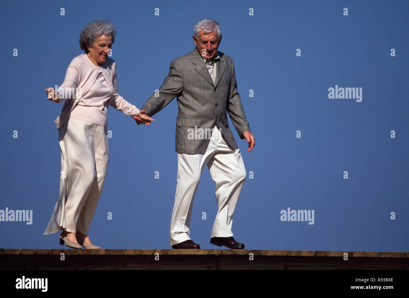 Senior couple walking on dock hi-res stock photography and images - Alamy