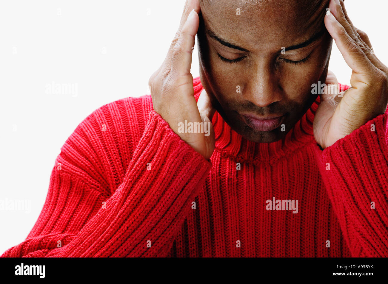 African man rubbing his temples Stock Photo - Alamy