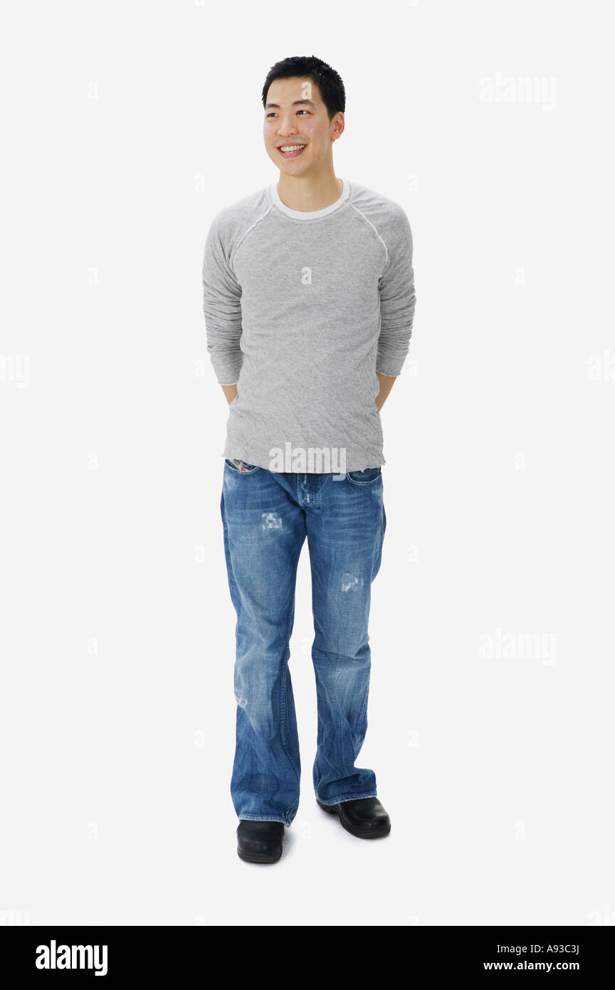 Portrait of Asian man with hands behind back Stock Photo - Alamy