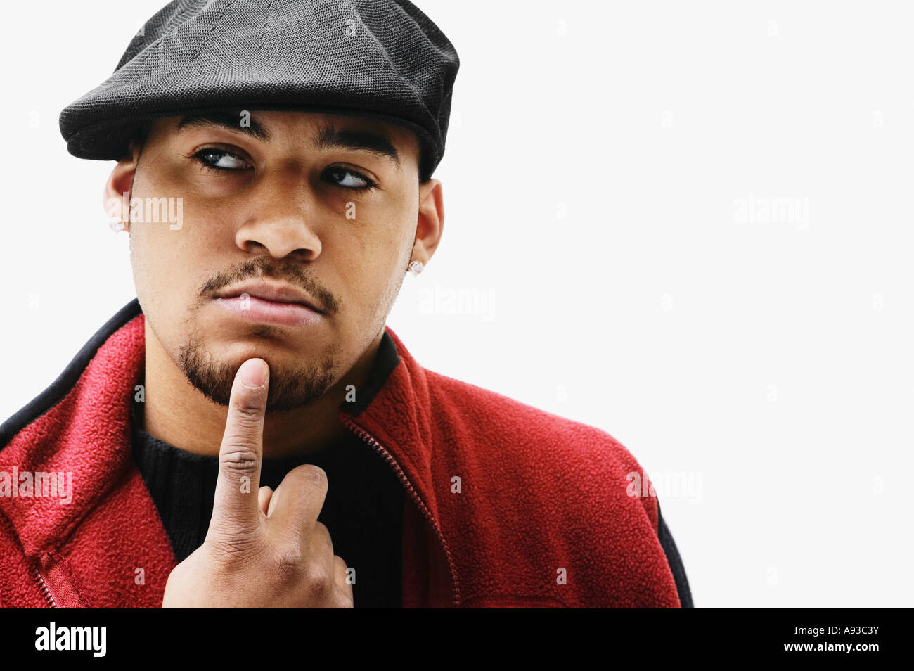 Portrait of African man with index finger on chin Stock Photo - Alamy