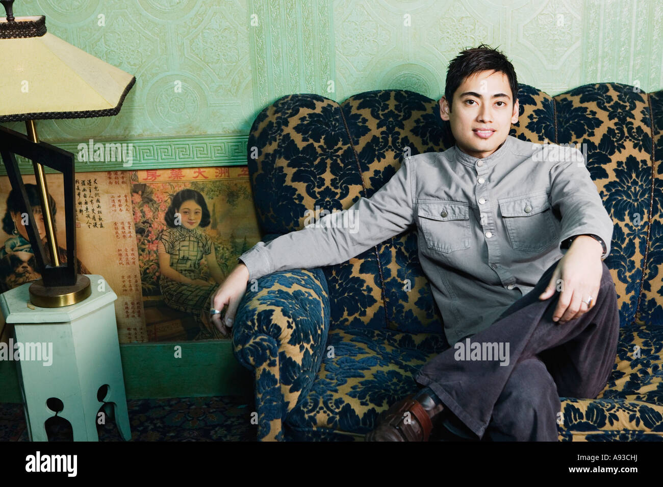Portrait of Pacific Islander man on sofa Stock Photo - Alamy
