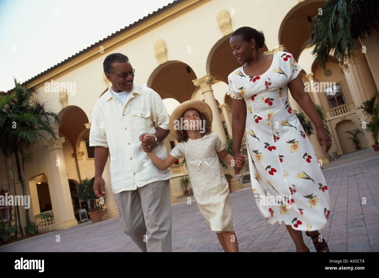 Grandparents walking with their granddaughter Stock Photo - Alamy