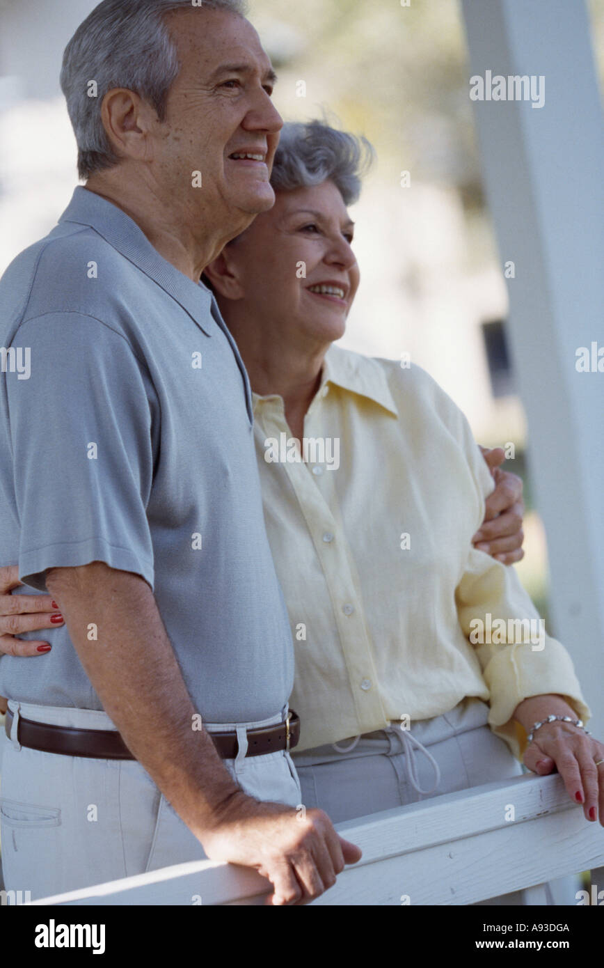 Side profile of senior couple standing with their arms around Stock ...