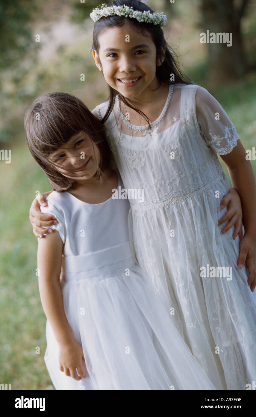 Portrait of two girls with their arms around each other Stock Photo - Alamy
