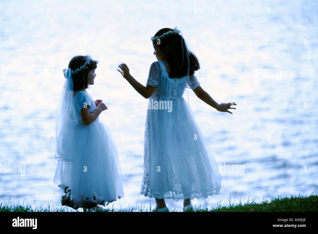 Two flower girls playing Stock Photo - Alamy