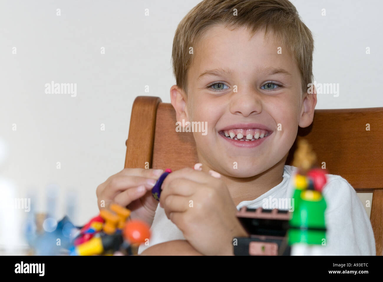 Portrait of a boy playing Stock Photo - Alamy