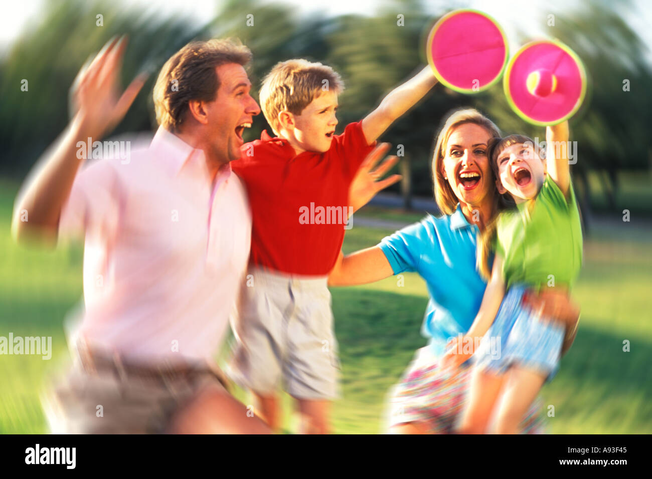 Family playing outdoor game Stock Photo - Alamy