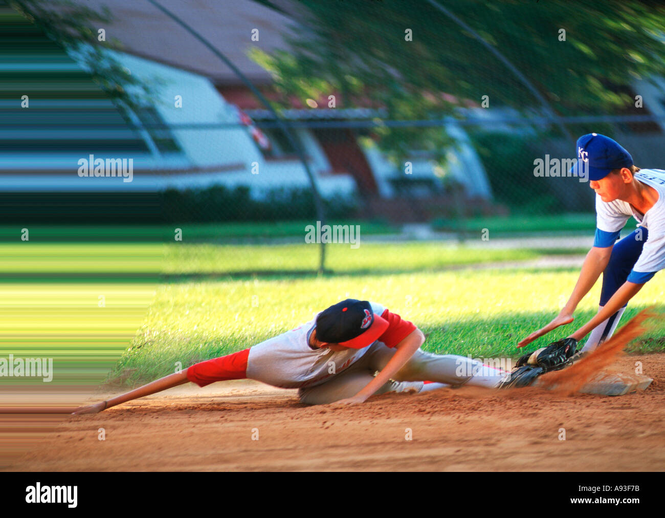 Action Baseball player sliding into base Stock Photo - Alamy