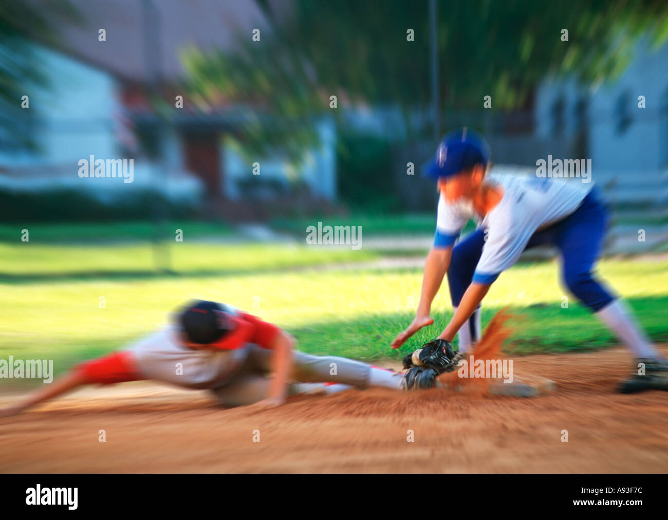 Action Baseball player sliding into base Stock Photo - Alamy