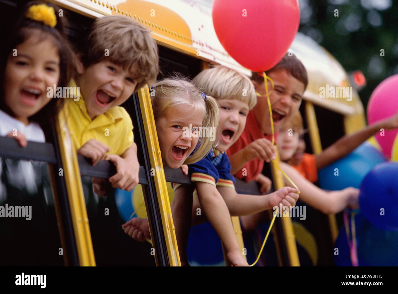 Group of children shouting on a school bus Stock Photo - Alamy