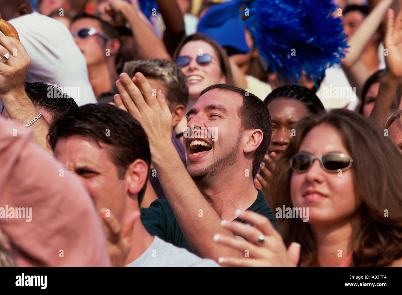 Group of spectators cheering in a stadium Stock Photo - Alamy
